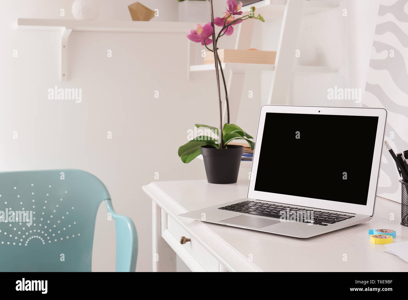 Stylish modern workplace with laptop at home Stock Photo - Alamy