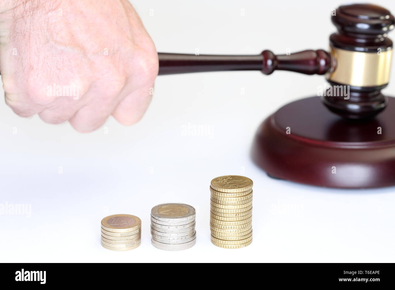 auction symbol with coin stacks Stock Photo - Alamy