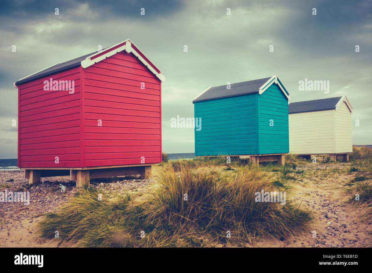 Row of traditional british beach huts hi-res stock photography and ...