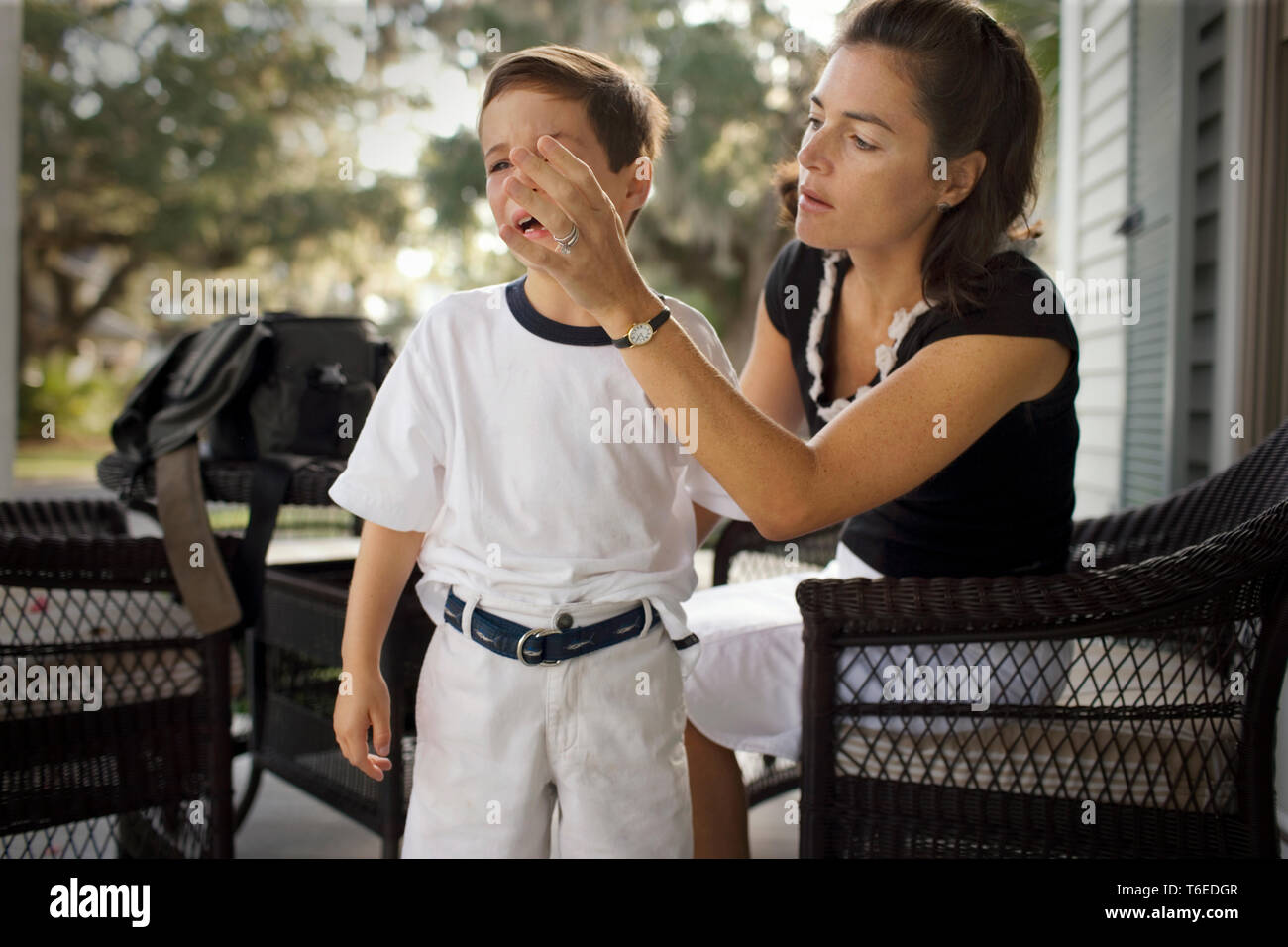 Child wiping tears of mother hi-res stock photography and images - Alamy
