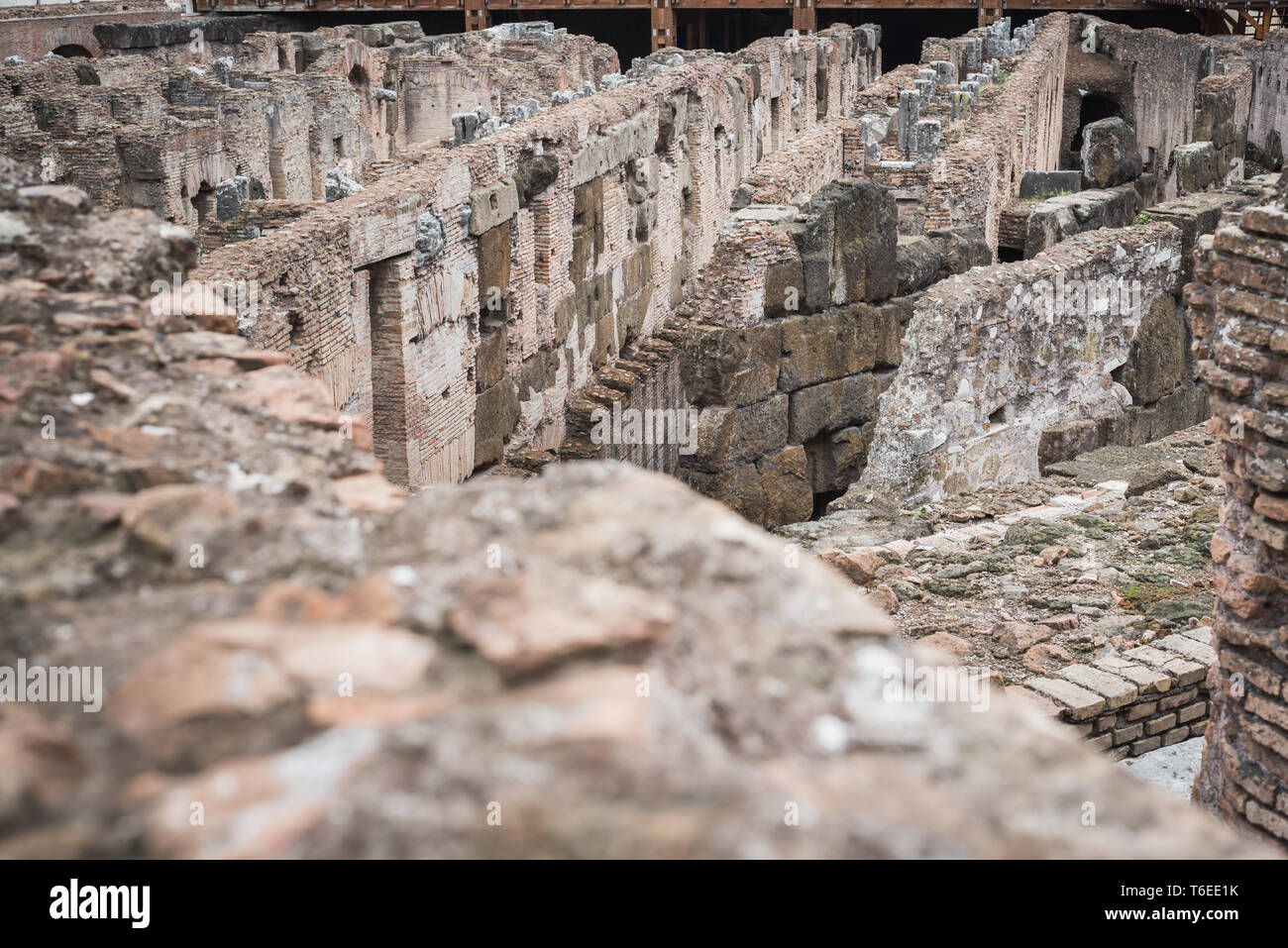 Close-up on the old stones of the basement of the Colosseum in Rome ...