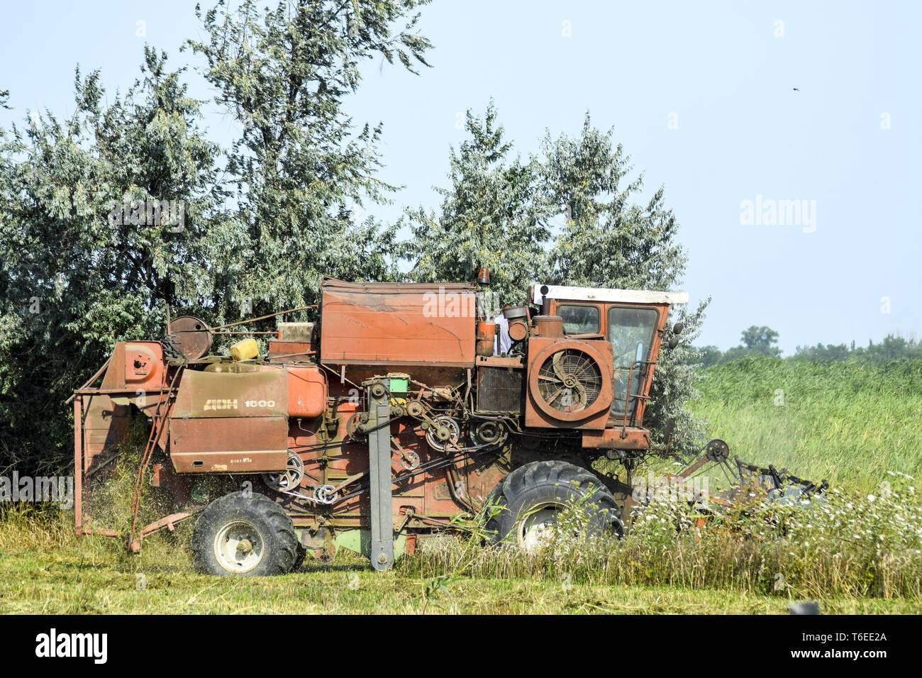 Old rusty combine harvester Stock Photo - Alamy