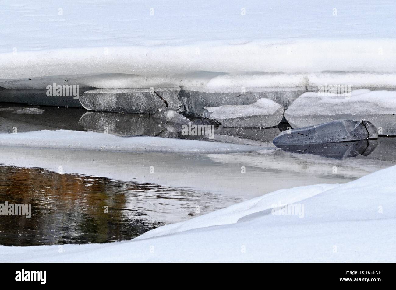 frozen ice on the water Stock Photo - Alamy