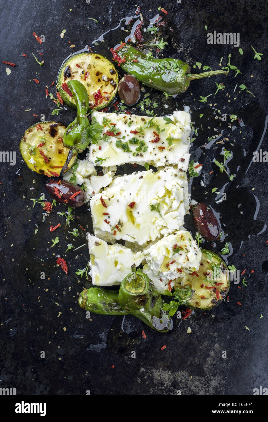 Traditional Greek feta with vegetable peperoni as top view with copy ...