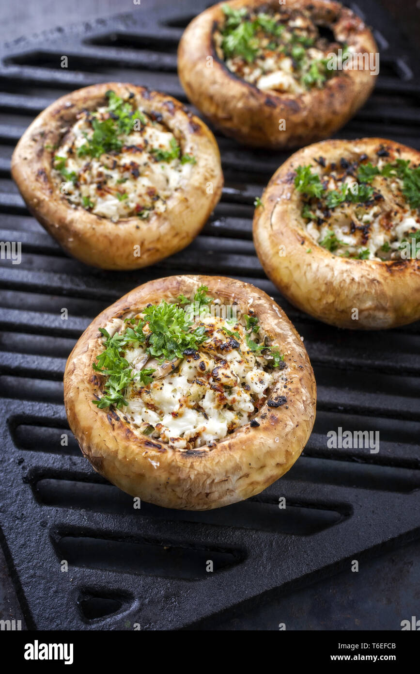 Traditional Italian Mushroom Caps stuffed with Feta as close-up on a ...
