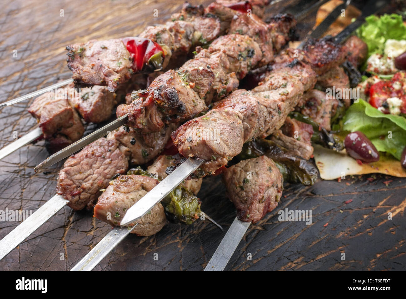 Traditional Shashlik with Salad and Yufka Bread as top view on an old ...