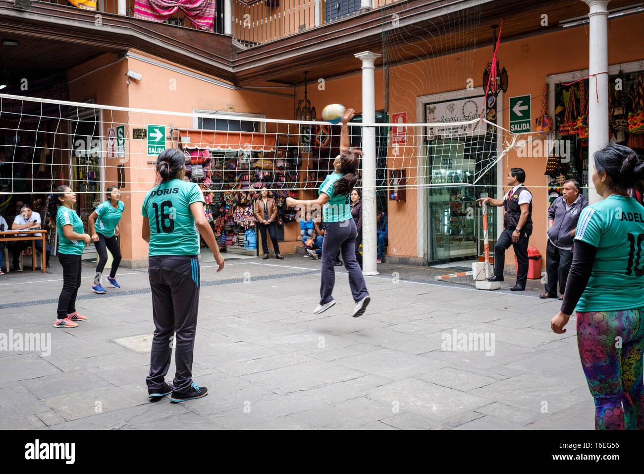 Volleyball female competition on an interior courtyard of a building in ...