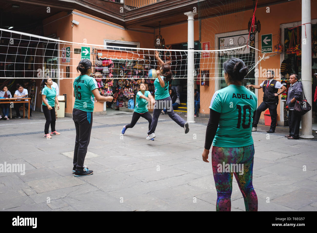 Volleyball female competition on an interior courtyard of a building in ...