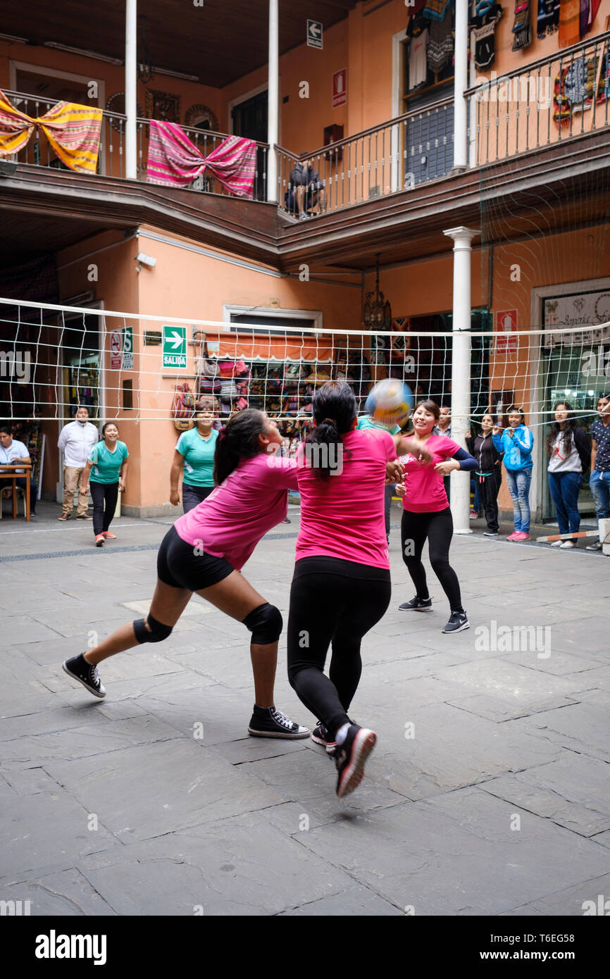 Volleyball female competition on an interior courtyard of a building in ...