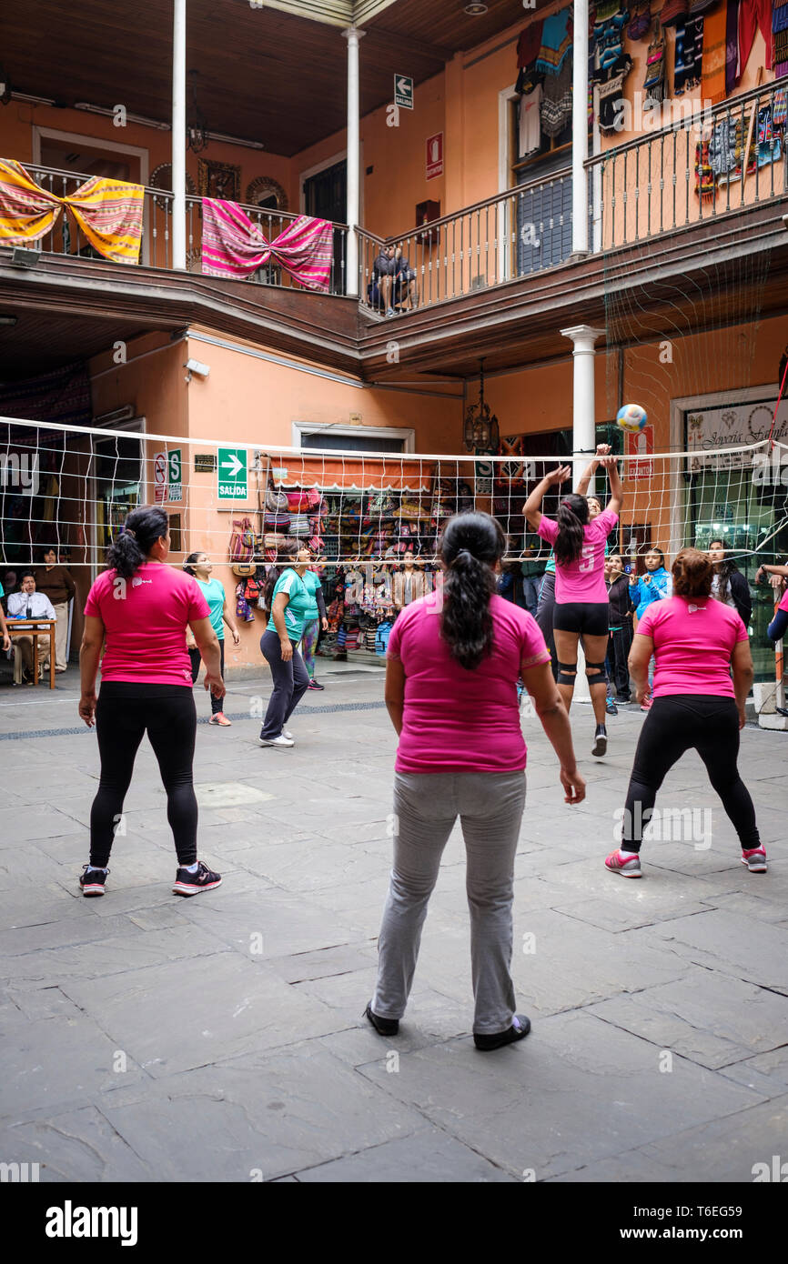 Volleyball female competition on an interior courtyard of a building in ...