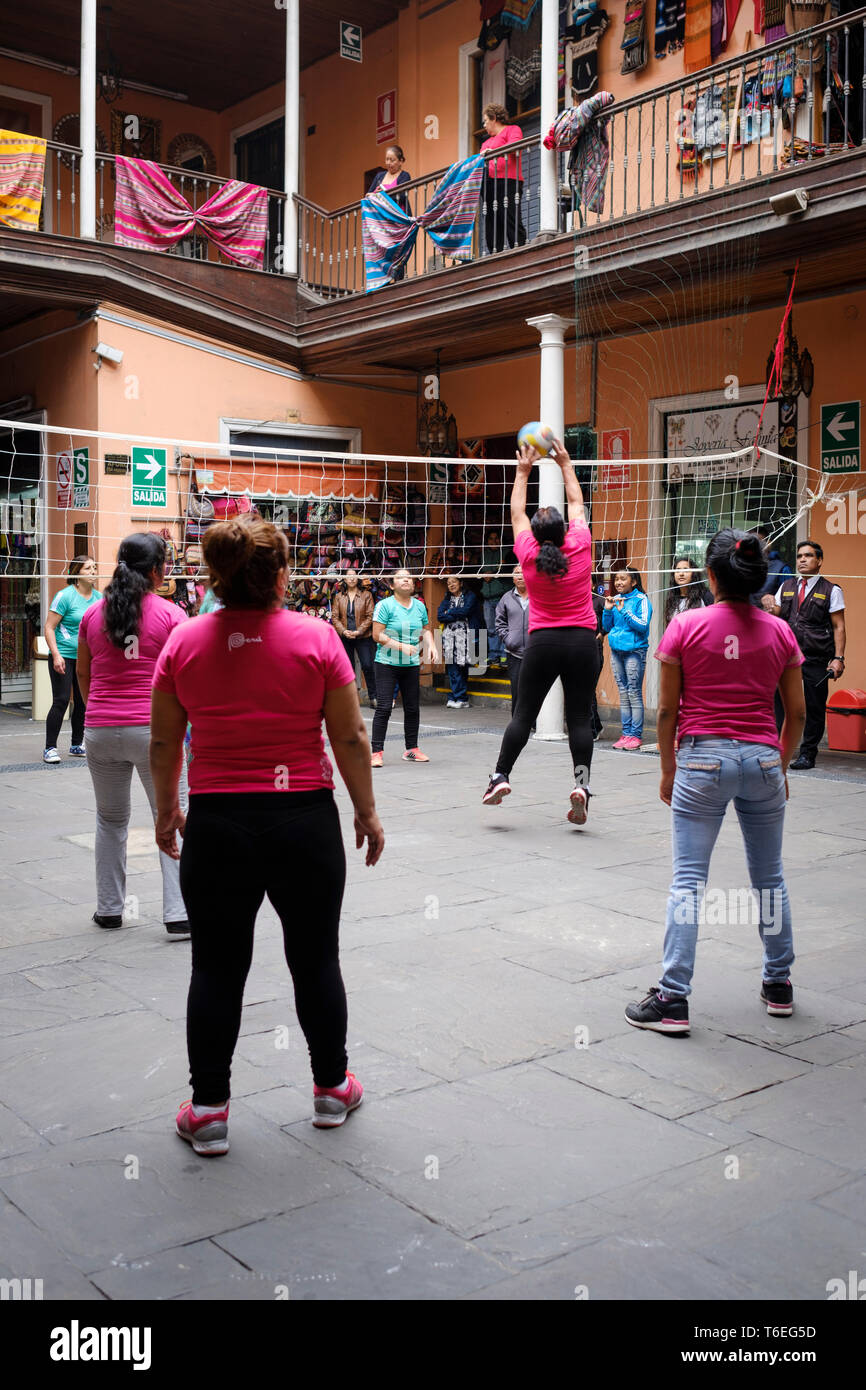 Volleyball female competition on an interior courtyard of a building in ...