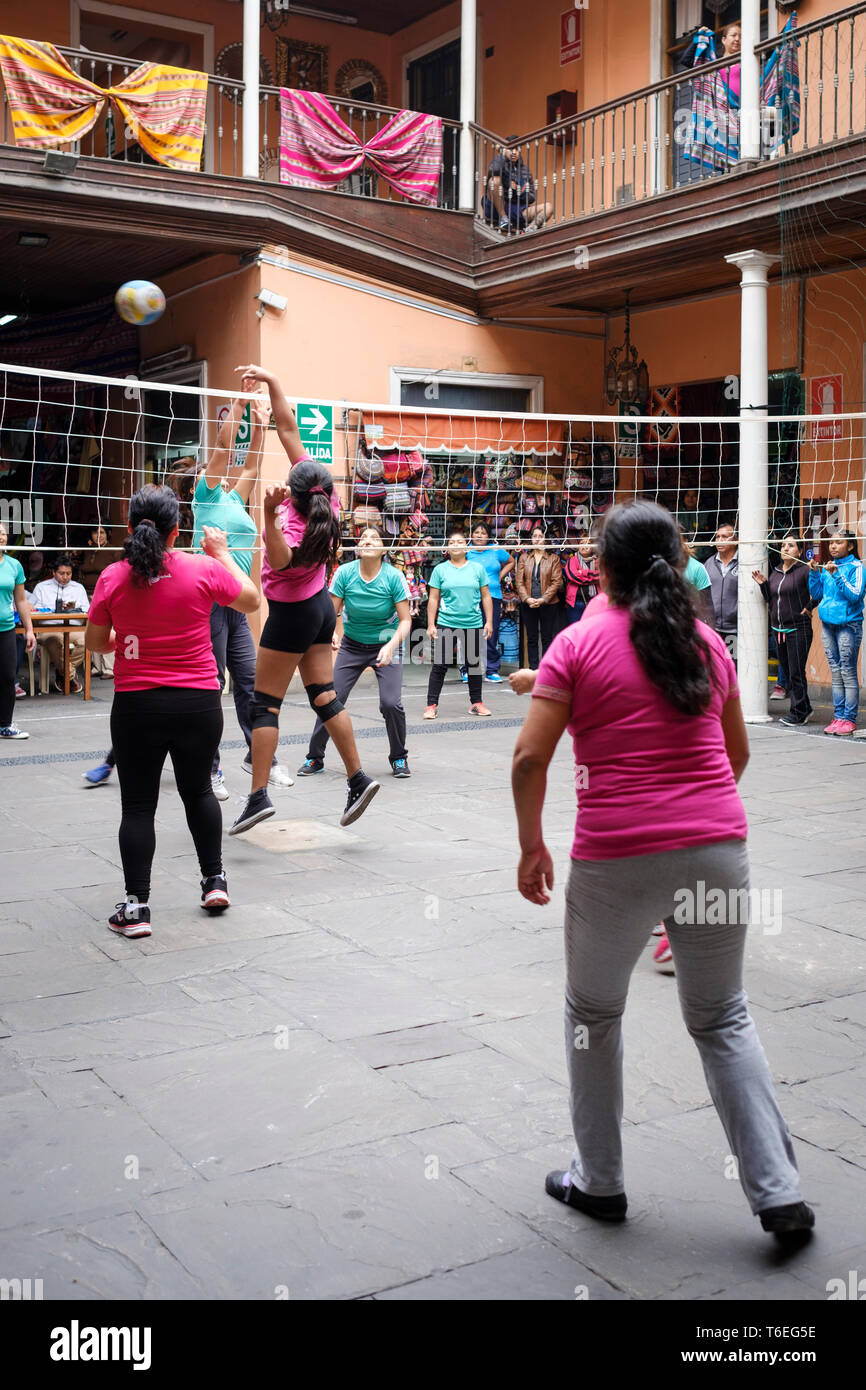 Volleyball female competition on an interior courtyard of a building in ...