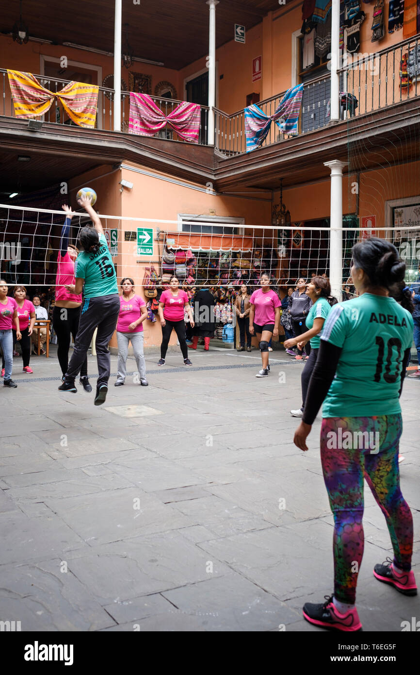 Volleyball female competition on an interior courtyard of a building in ...