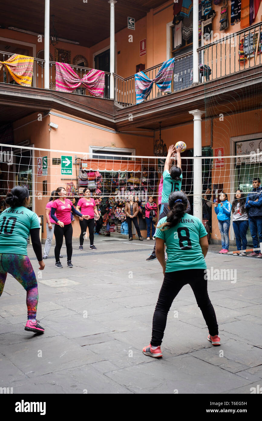 Volleyball female competition on an interior courtyard of a building in ...