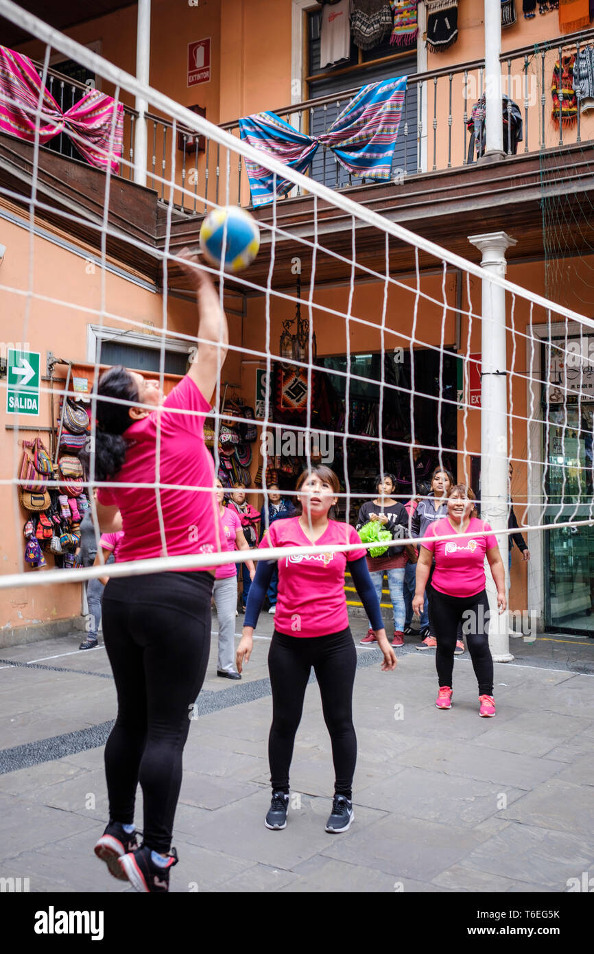 Volleyball female competition on an interior courtyard of a building in ...