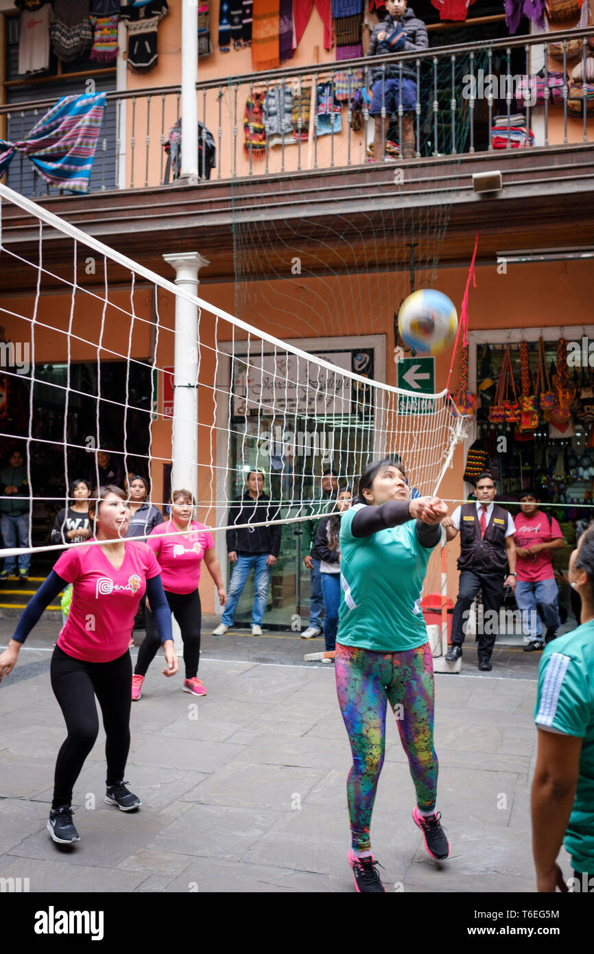 Volleyball female competition on an interior courtyard of a building in ...