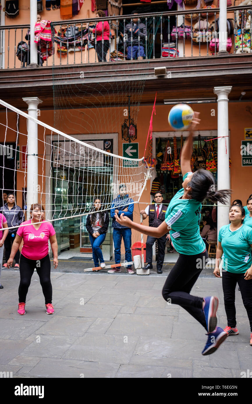 Volleyball female competition on an interior courtyard of a building in ...