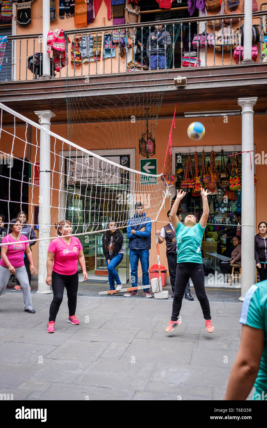 Volleyball female competition on an interior courtyard of a building in ...