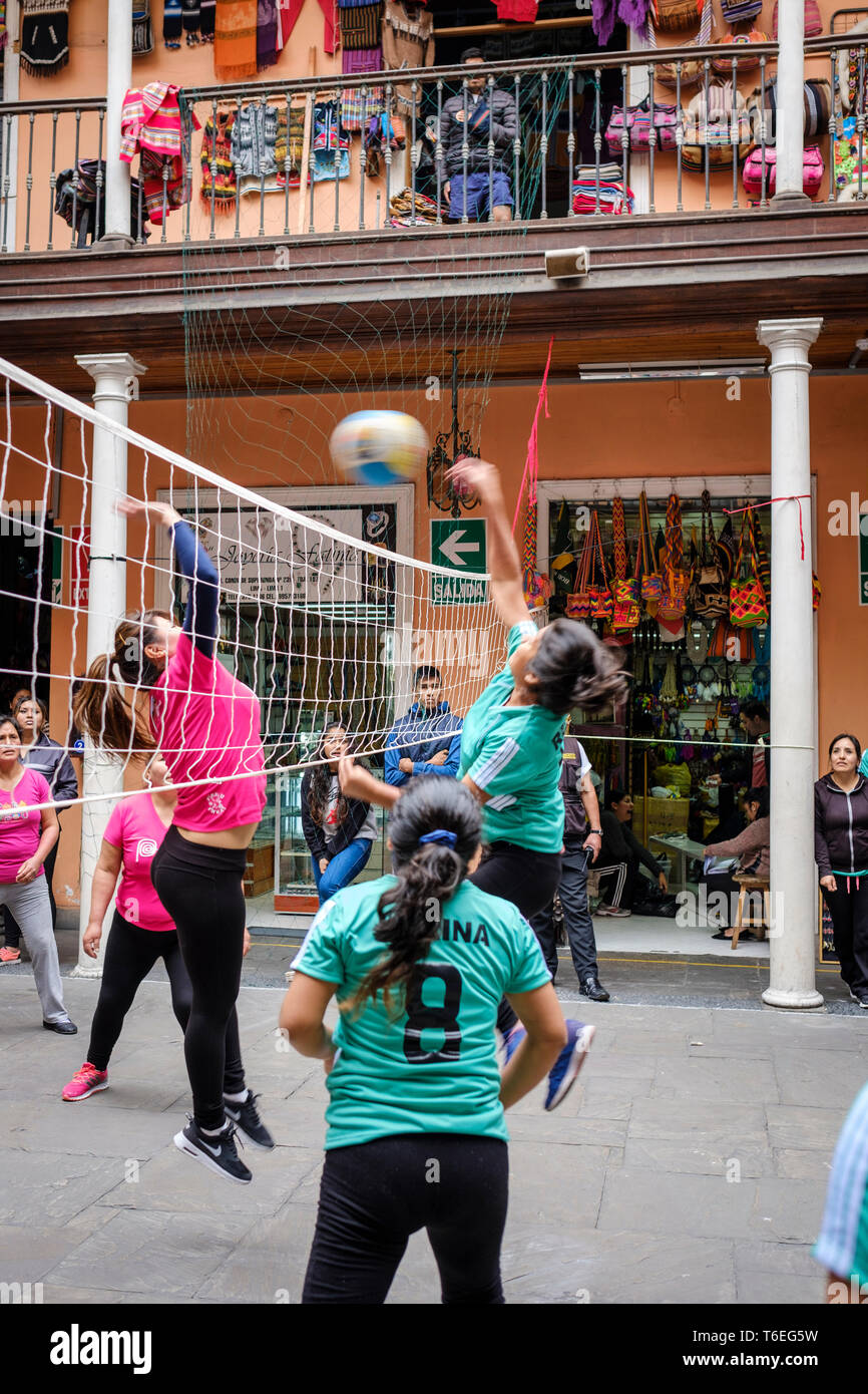 Volleyball female competition on an interior courtyard of a building in ...