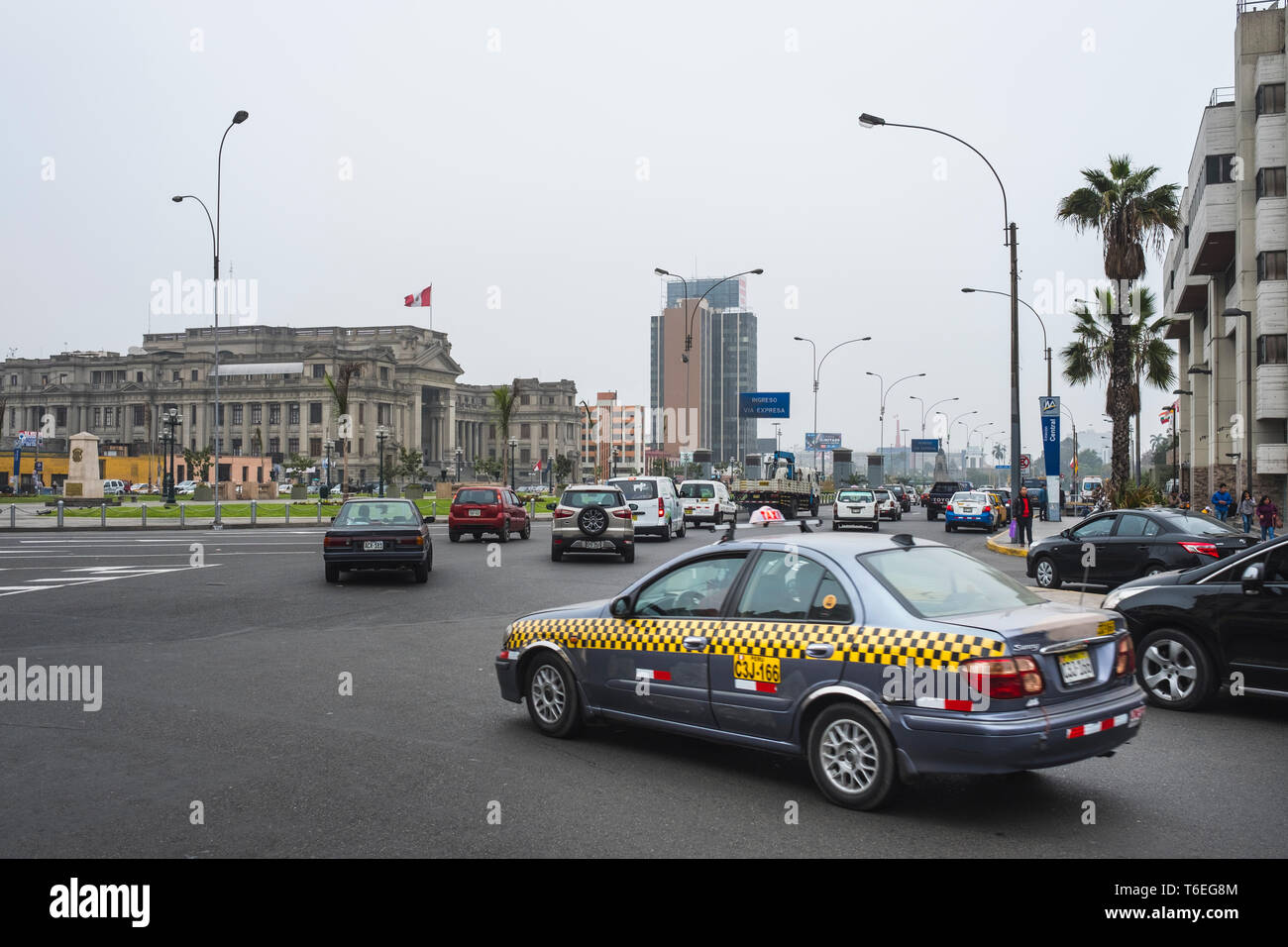 A taxi cab on the busy streets and pollution fog in Lima, Peru Stock ...