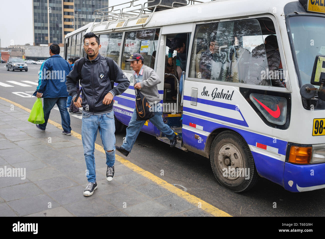 Passengers getting out of the bus in Lima, Peru Stock Photo - Alamy