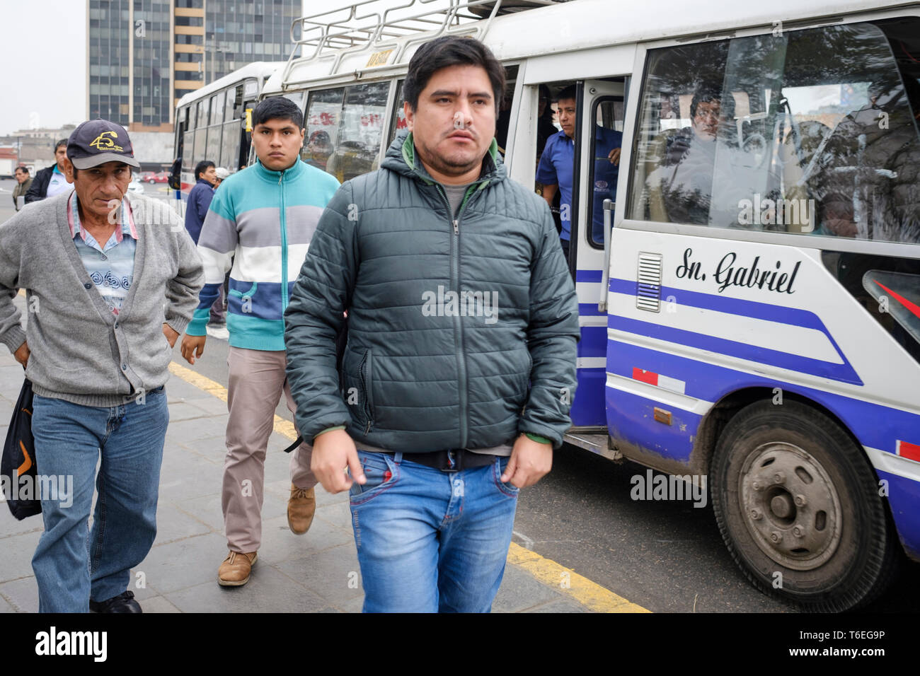 Passengers getting out of the bus in Lima, Peru Stock Photo - Alamy
