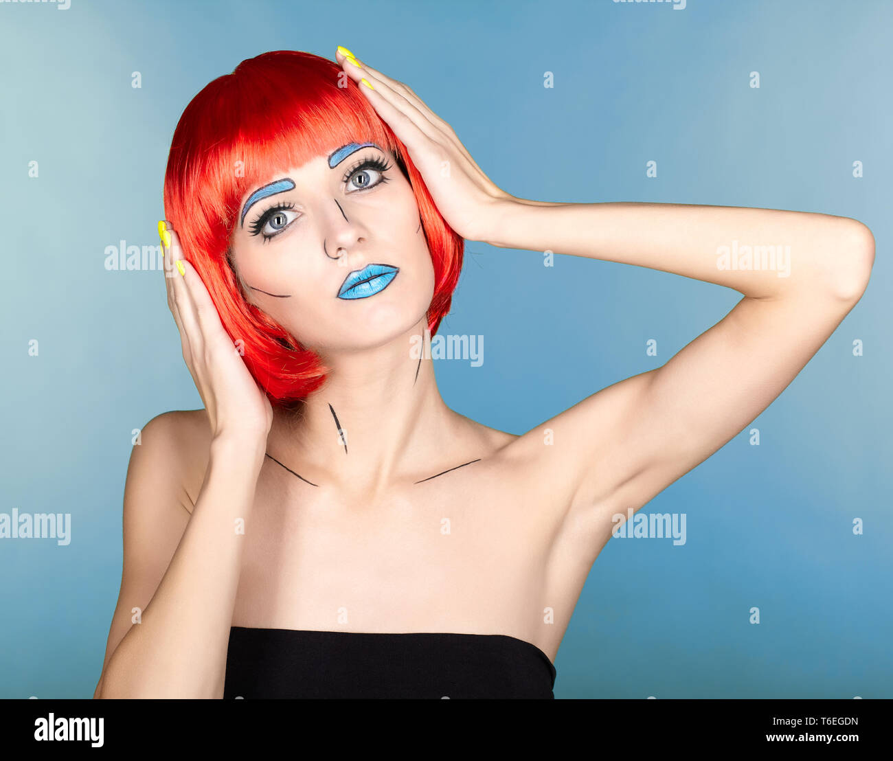 Female in red wig and in comic pop art make-up style on blue background ...