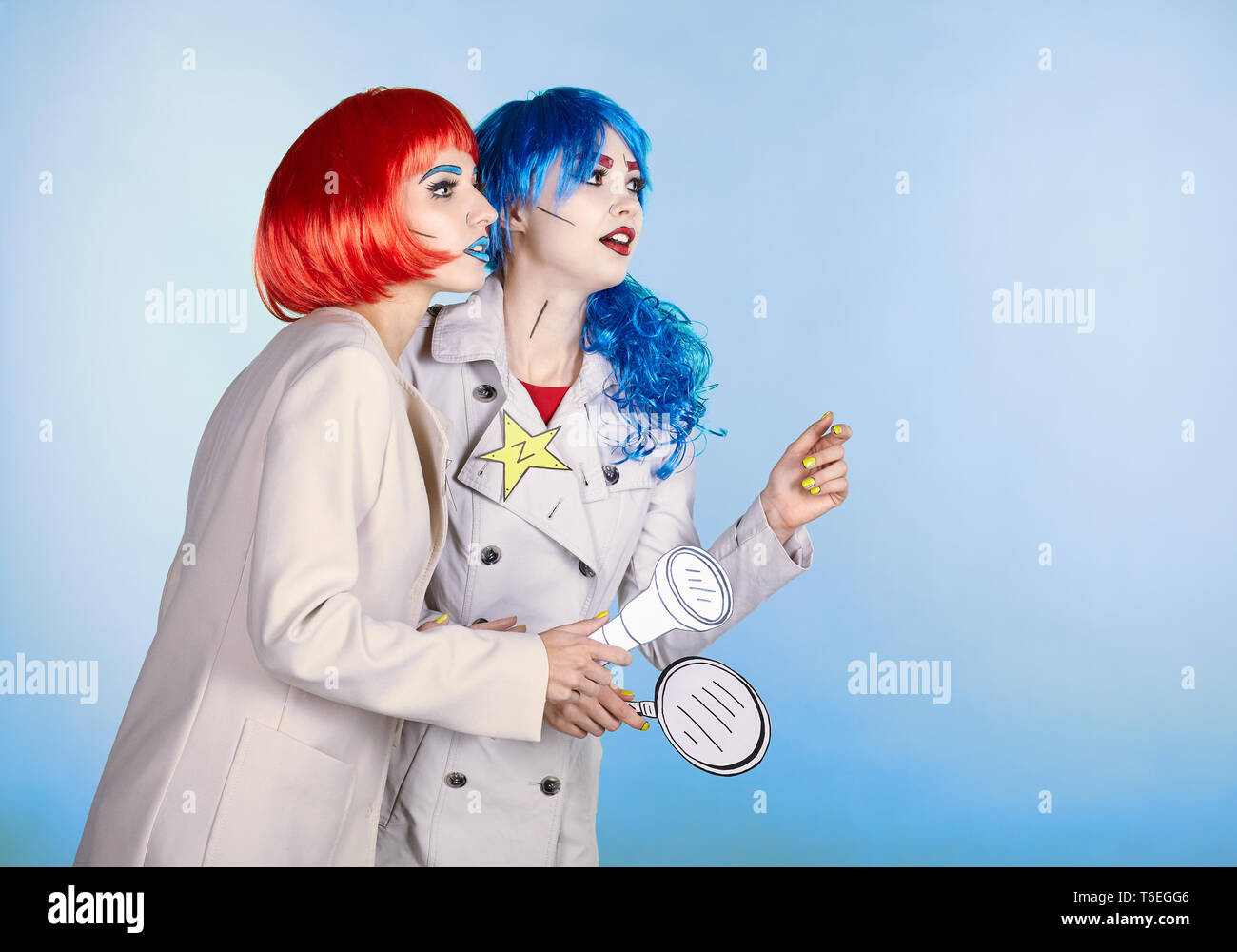 Female detectives investigate a crime. Young women in comic pop art ...