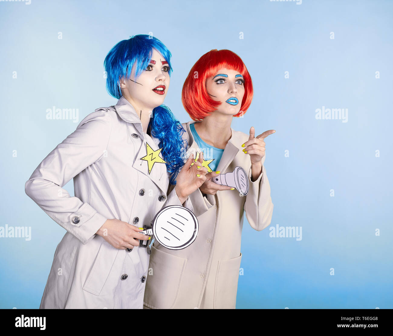 Female detectives investigate a crime. Young women in comic pop art ...