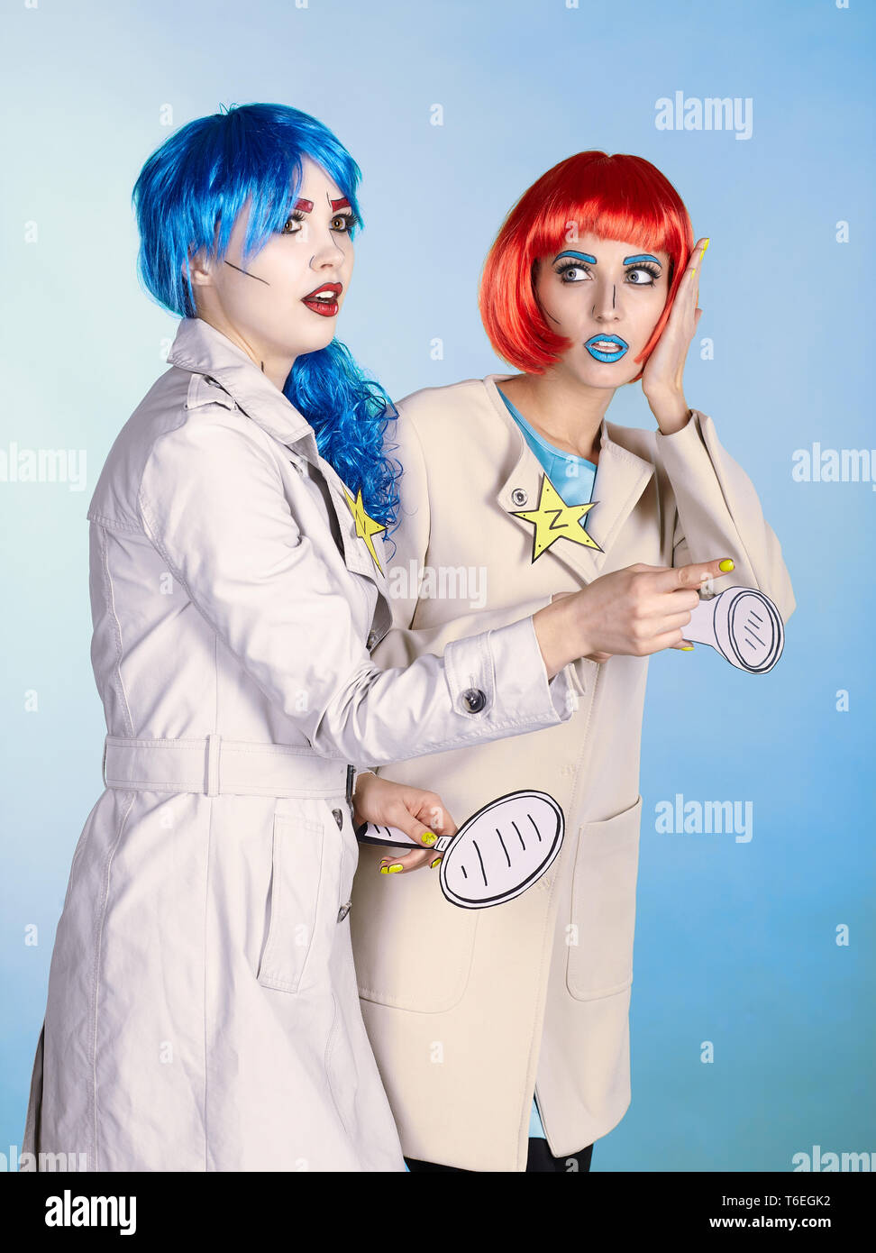 Female detectives investigate a crime. Young women in comic pop art ...