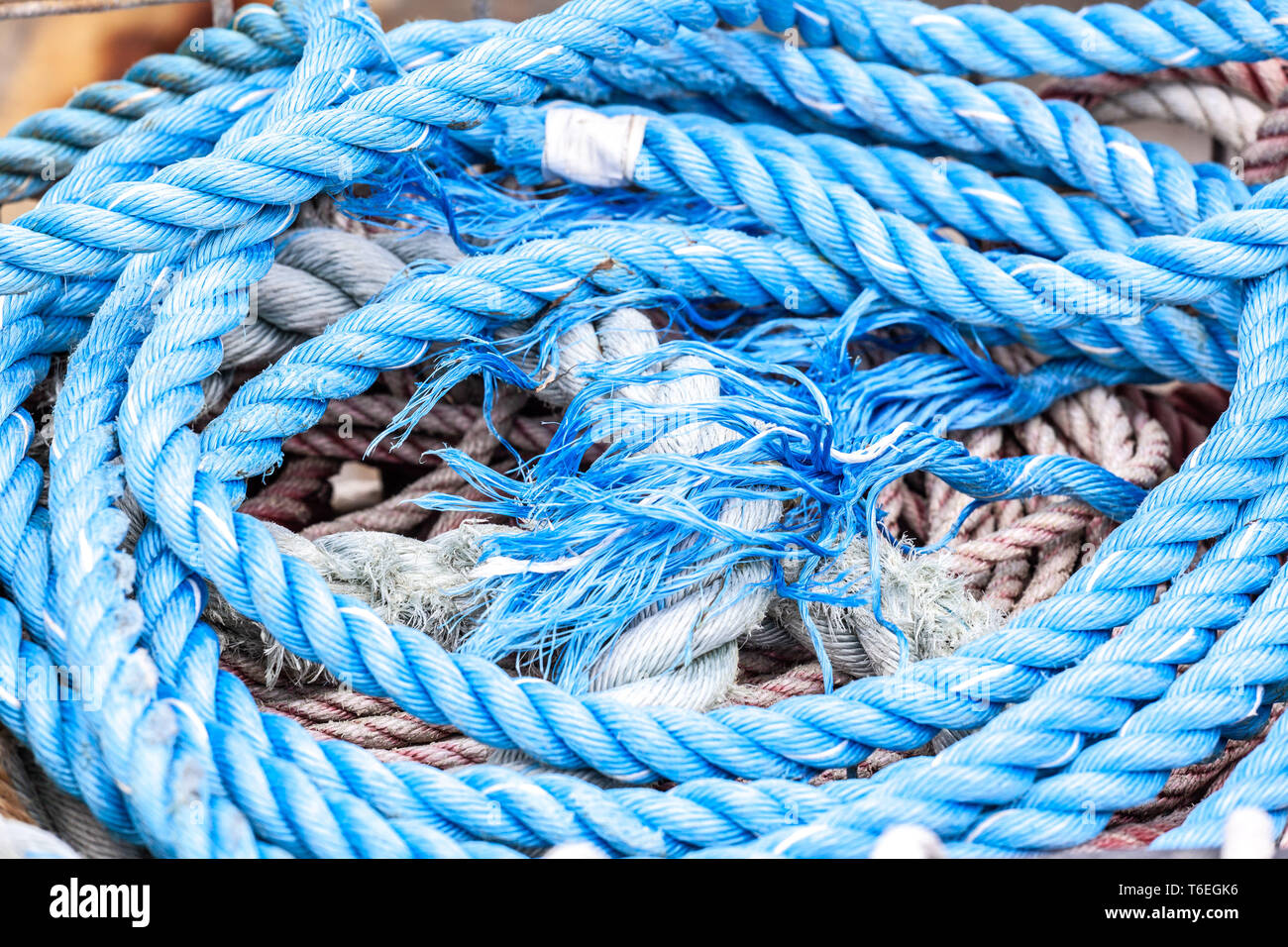 Vivid blue thick mooring rope extreme closeup Stock Photo - Alamy