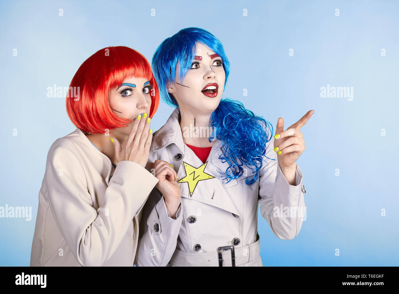 Female detectives investigate a crime. Young women in comic pop art ...