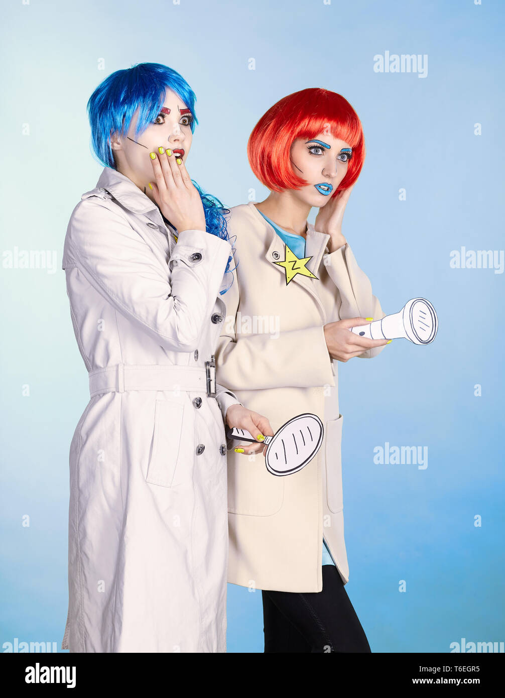 Female detectives investigate a crime. Young women in comic pop art ...