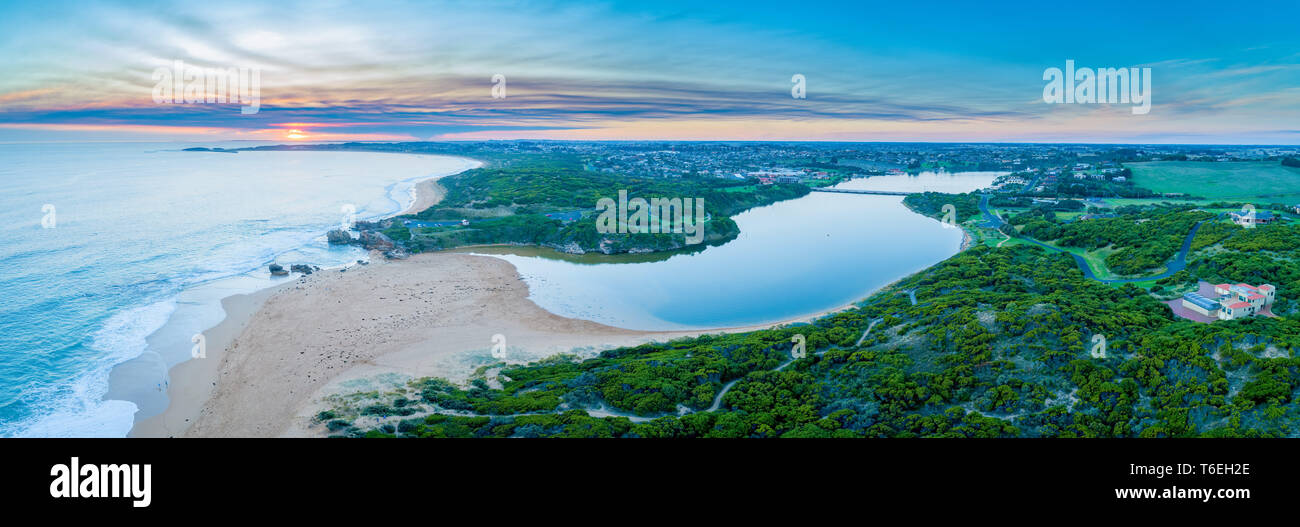 Aerial panorama of Hopkins River mouth and ocean coastline at sunset ...