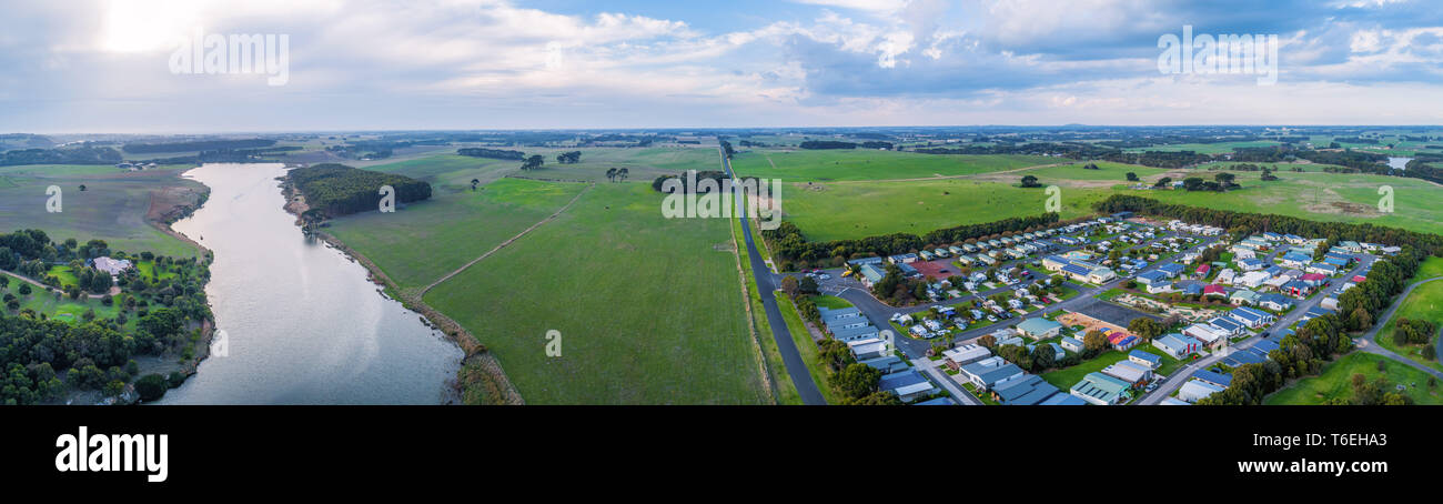 Wide aerial panorama of Hopkins River, Holiday Park and grasslands in ...