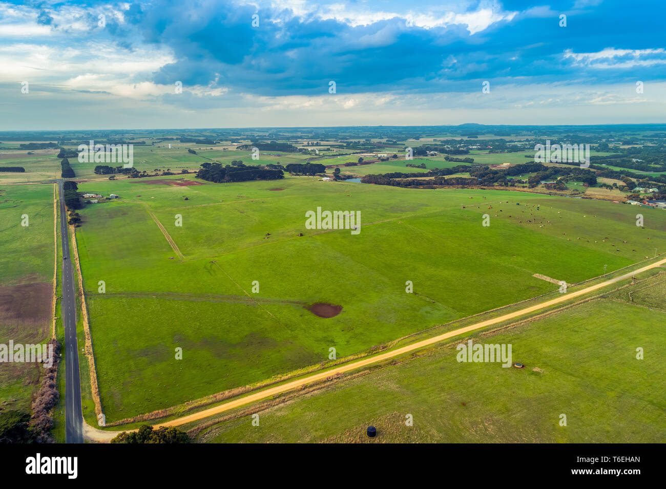 Aerial view of roads passing through scenic grasslands in rural ...