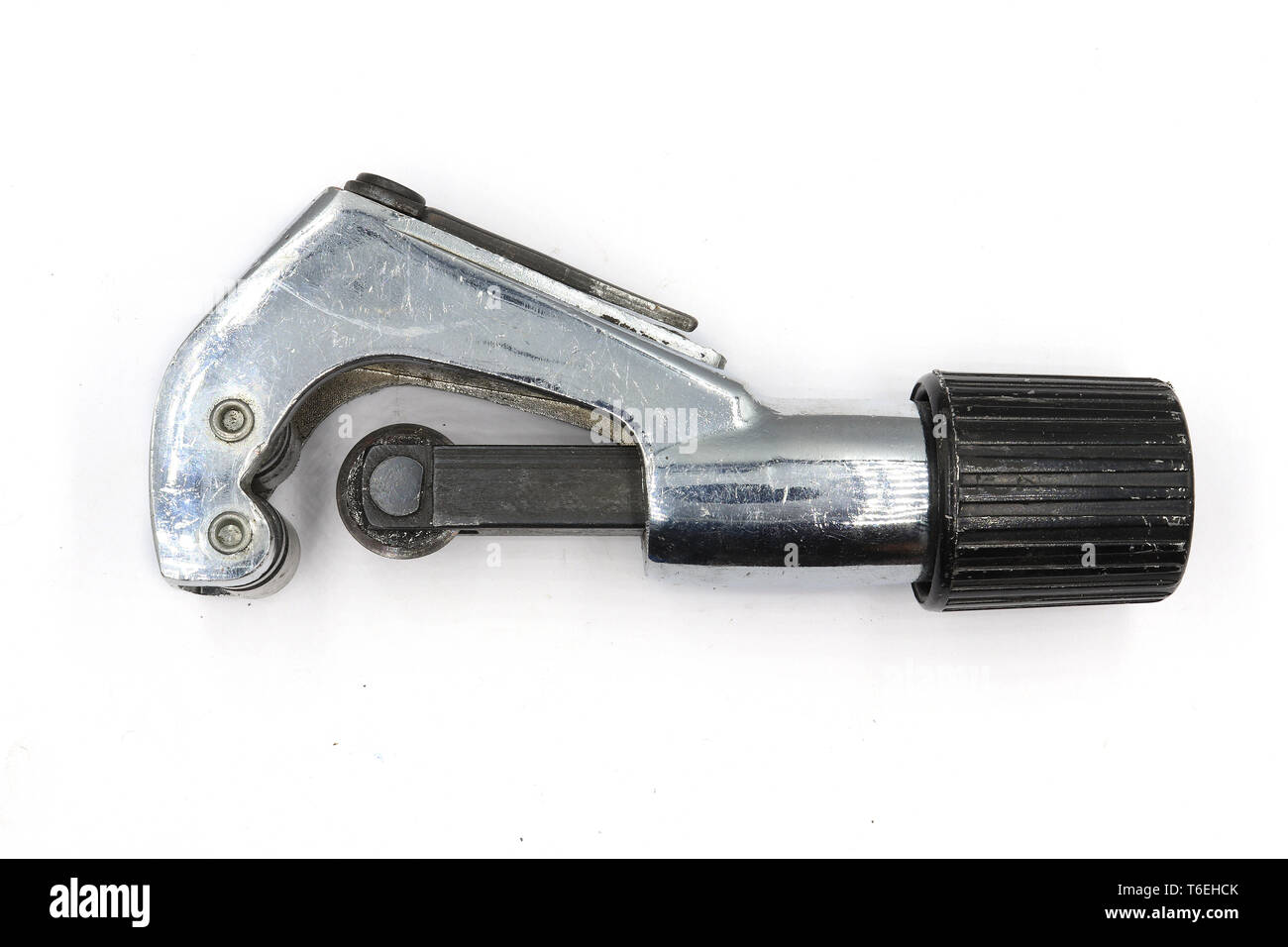 Metal pipe cutter, Industrial Plumber cutting a copper pipe, pipe cutter isolated on white ...