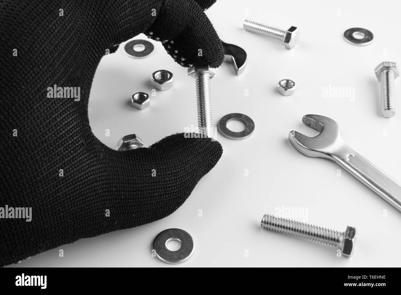 Man holding a bolt in his hands Stock Photo - Alamy