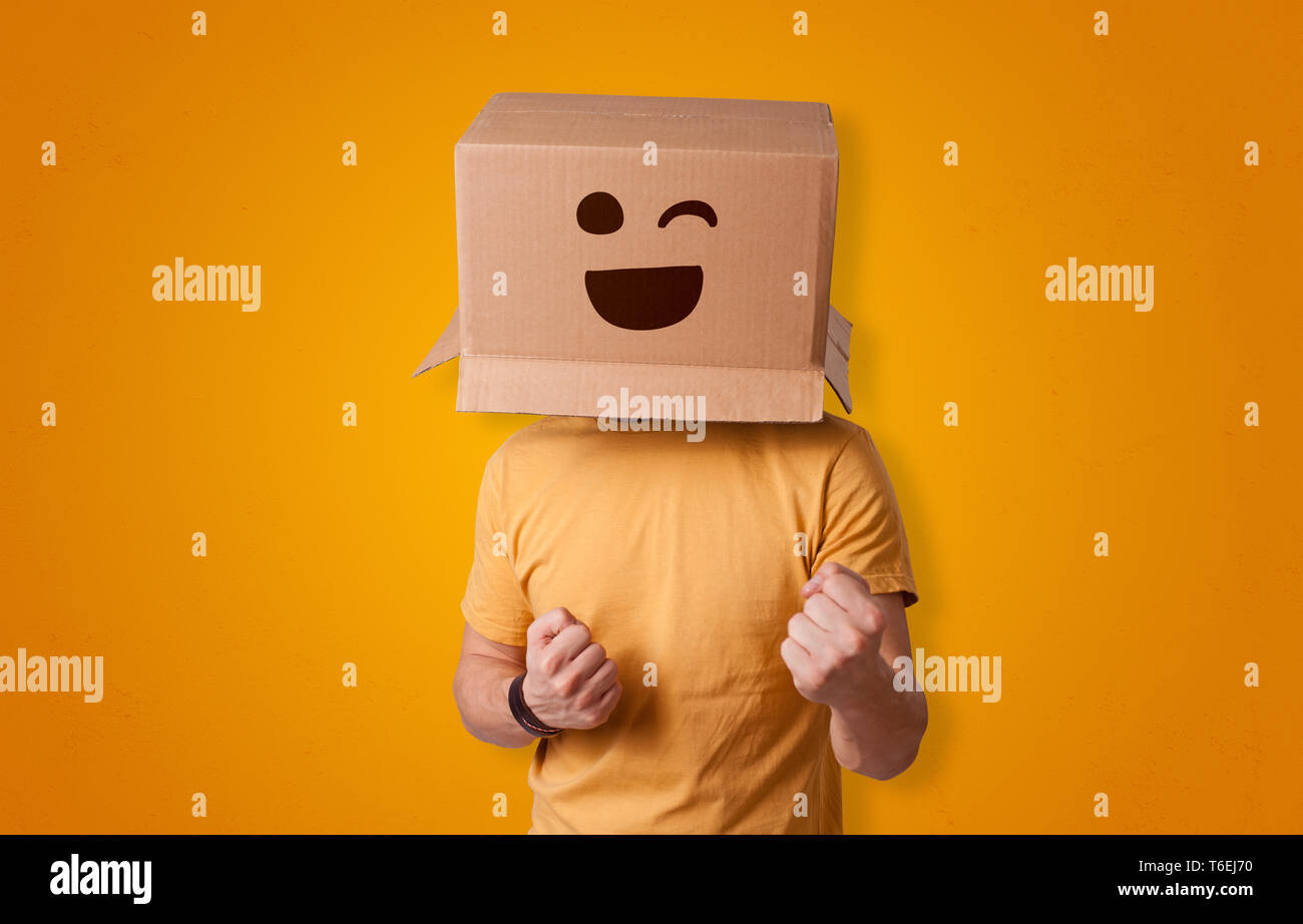 Funny man wearing cardboard box on his head with smiley face Stock ...