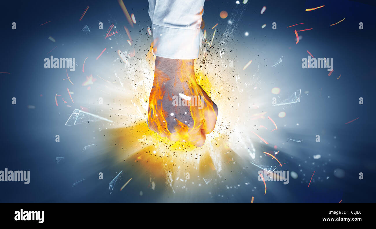 Hand hits strongly and makes fire beam around Stock Photo - Alamy