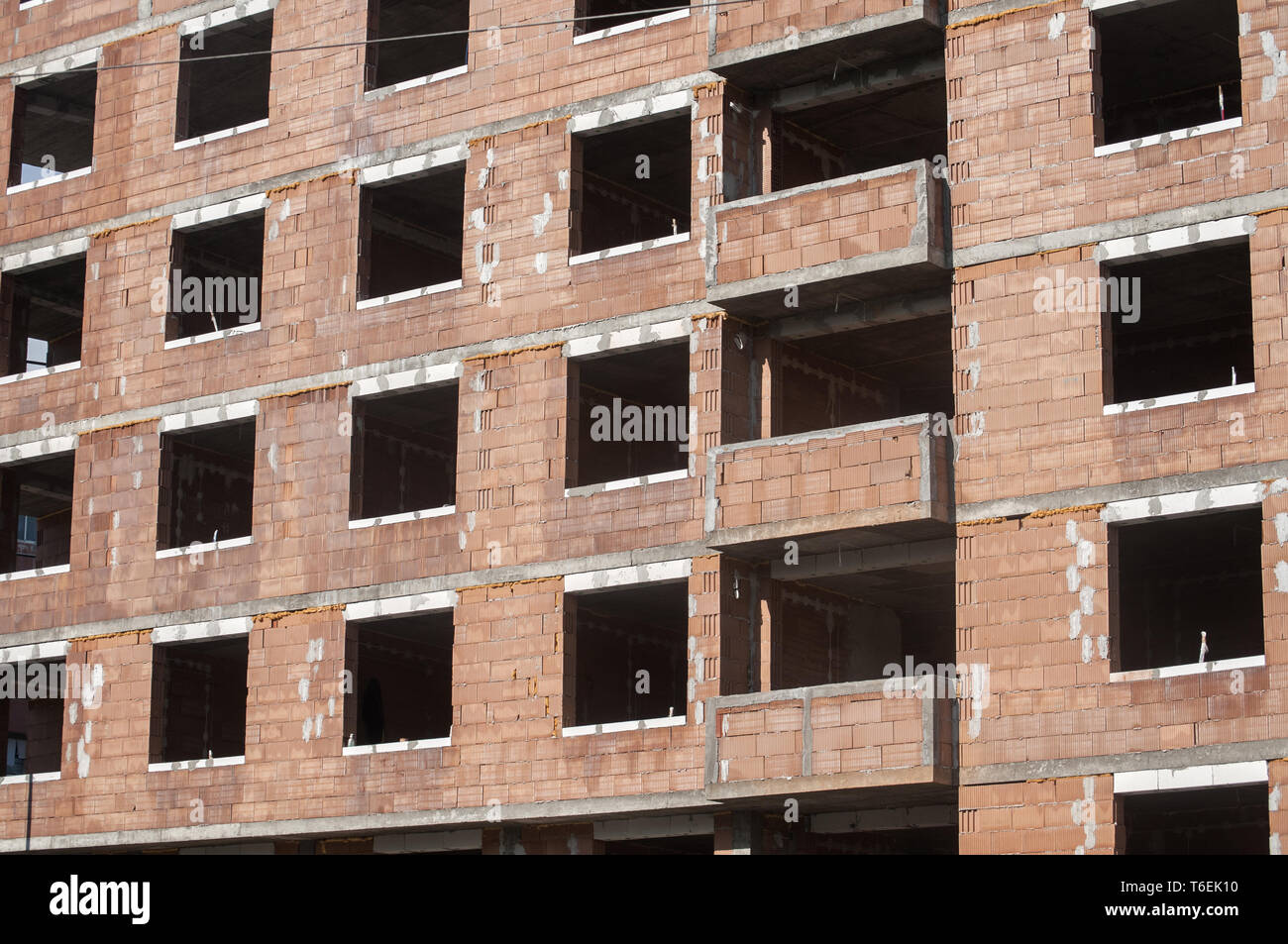 Residential solid building house under construction in red bricks shell ...