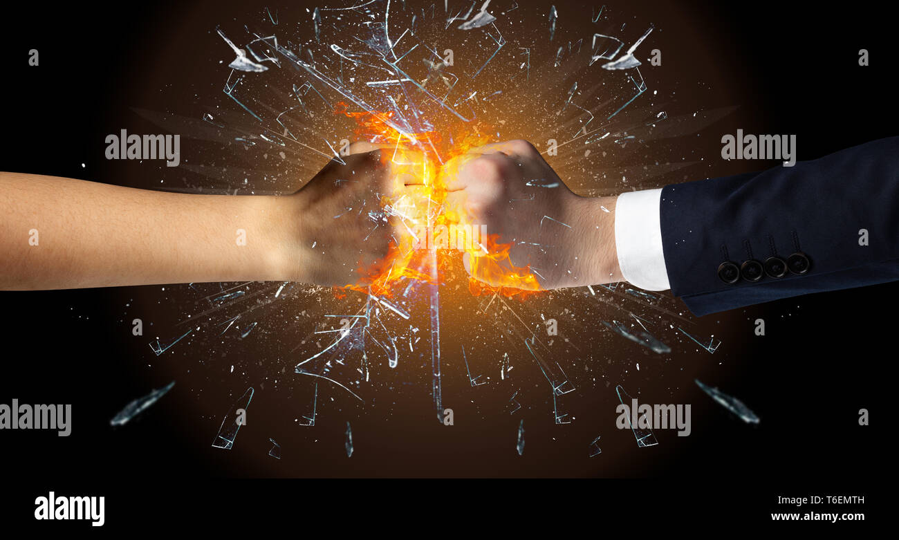 Two hands fighting and breaking a glass into small pieces Stock Photo ...