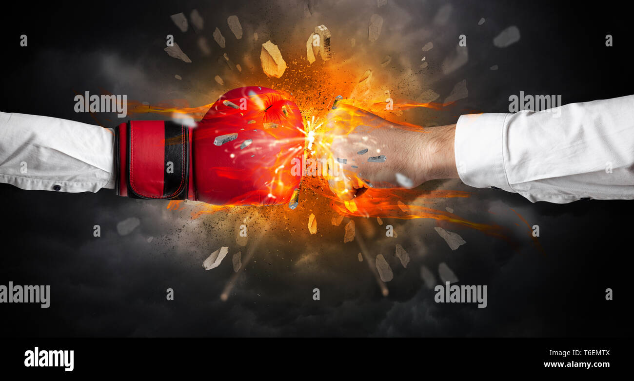 Two hands fighting and breaking a rock into small pieces Stock Photo ...