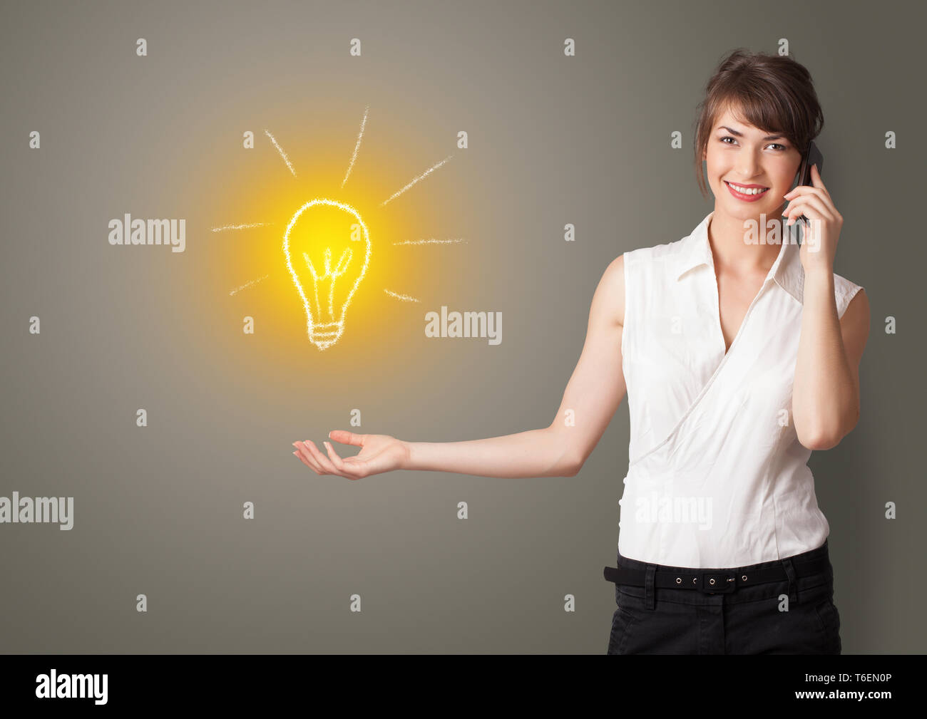 Young smiling person presenting new idea concept Stock Photo - Alamy