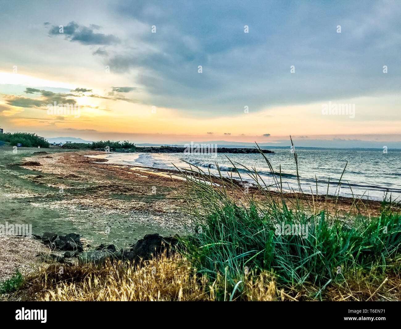 Beach and sea in bright sunlight Stock Photo - Alamy