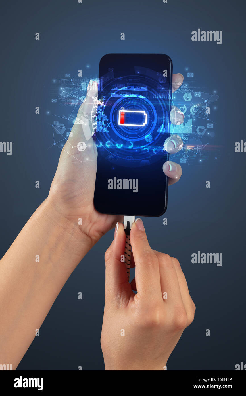 Elegant hand charging smartphone hi-res stock photography and images ...