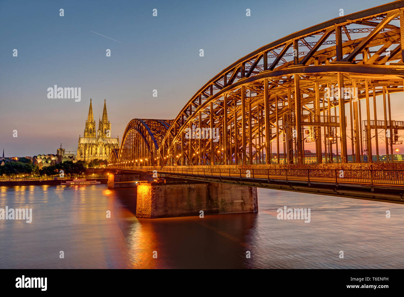 The Cologne Cathedral and the Hohenzollern railway bridge Stock Photo ...