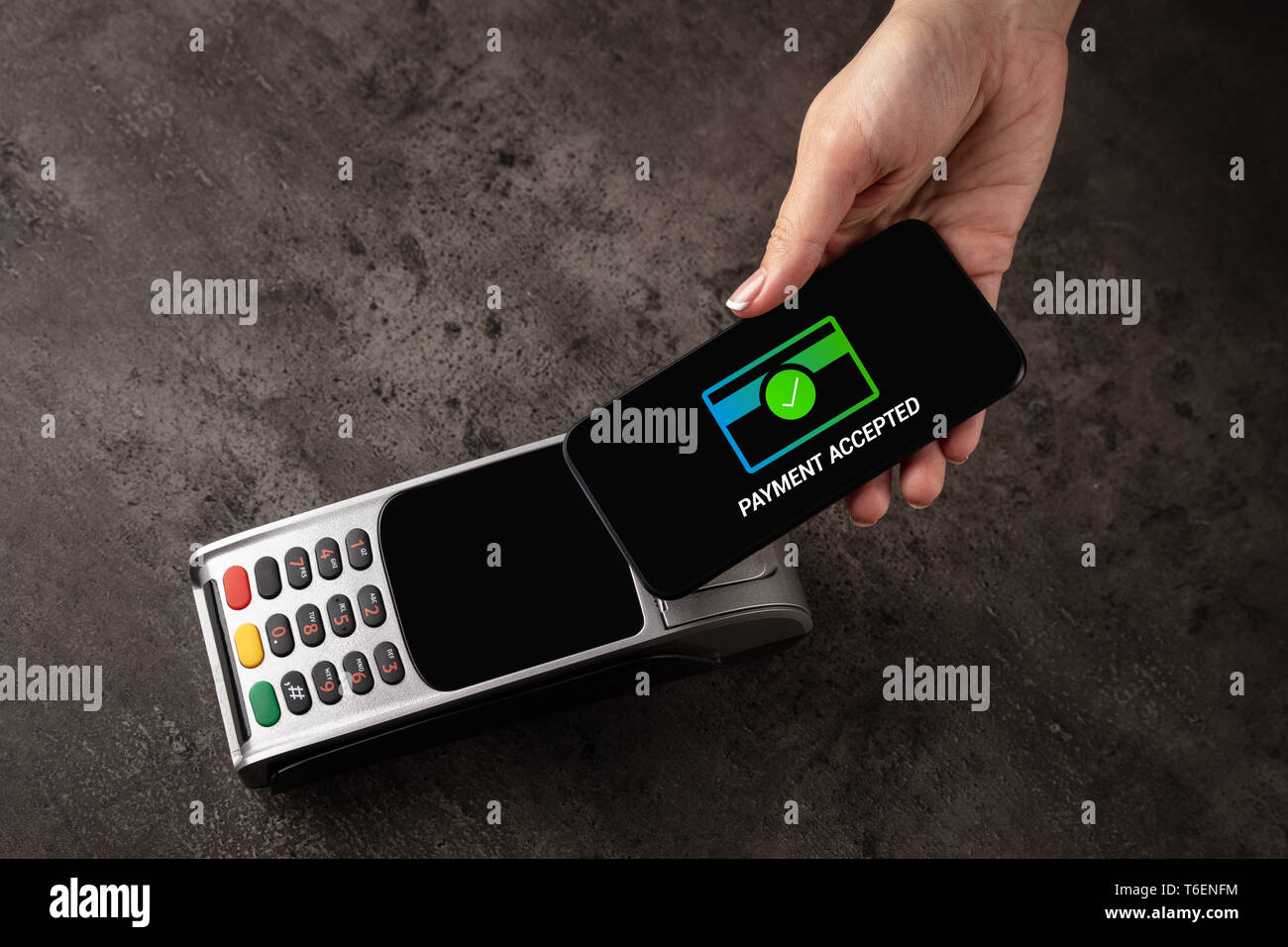 Payment accepted on terminal with mobile phone Stock Photo - Alamy