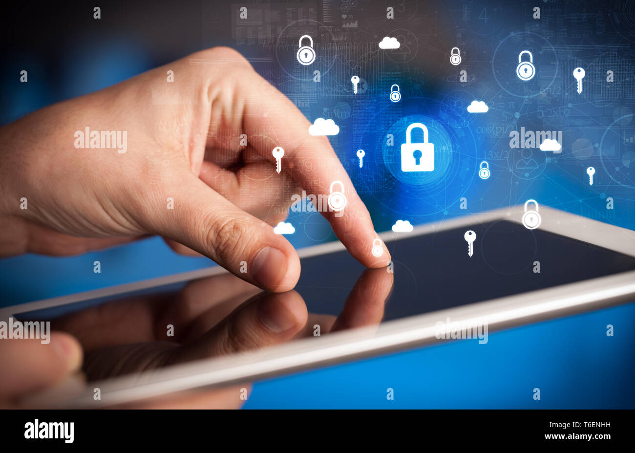 Hand holding tablet with online security system concept Stock Photo - Alamy