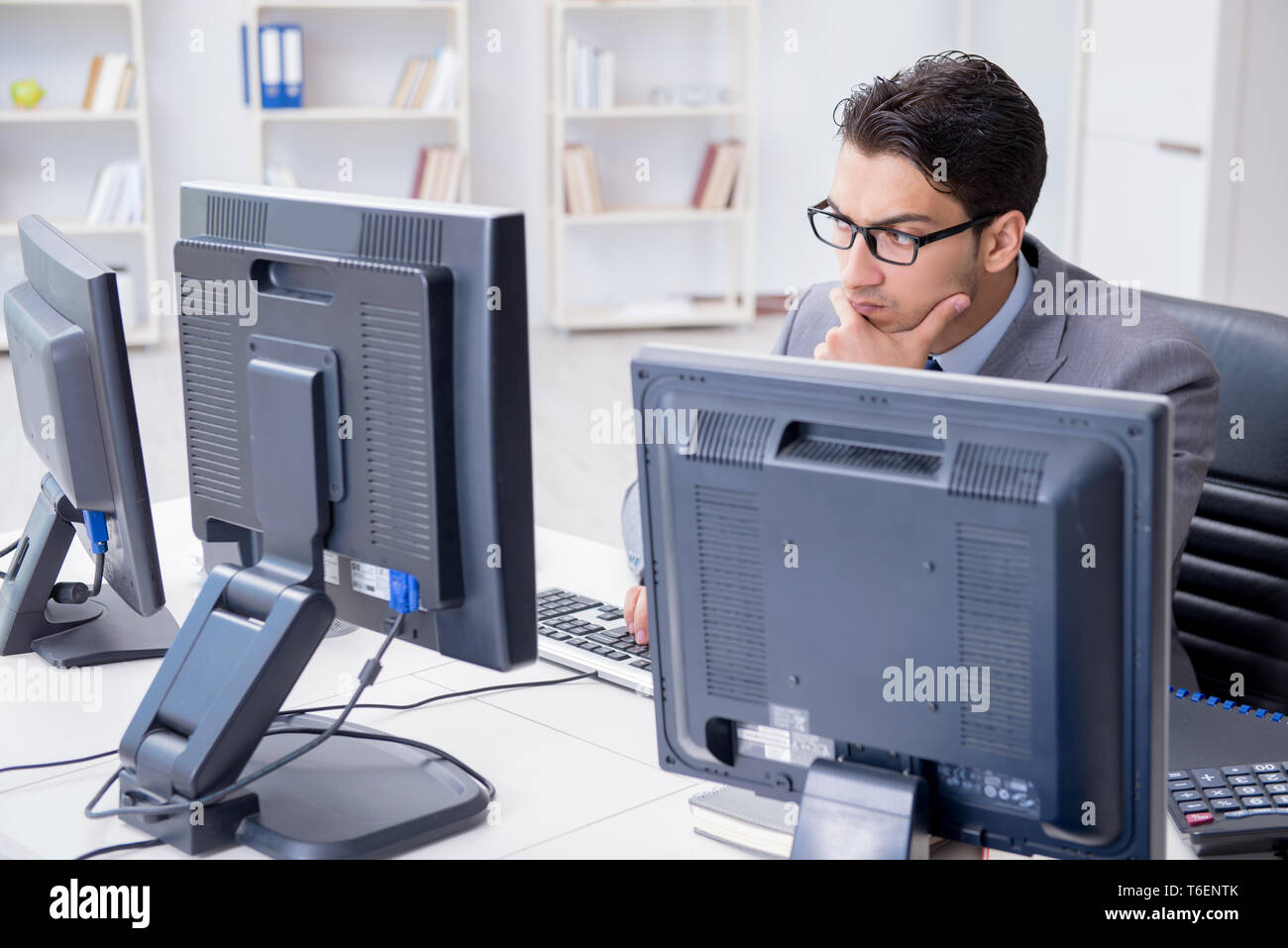 Man in front of many screens hi-res stock photography and images - Alamy